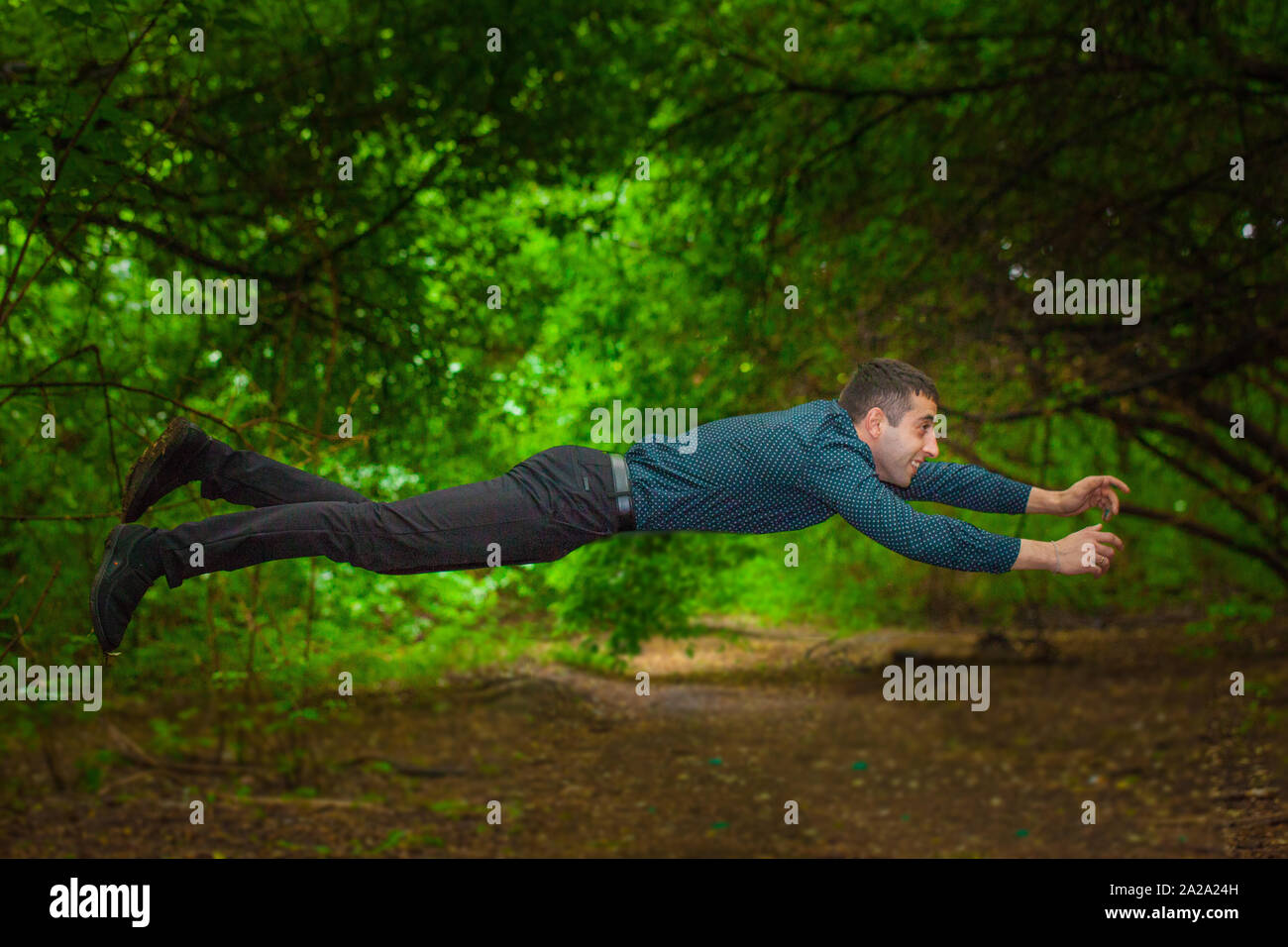 The concept of levitation. The man is flying. The boy flies through the ...