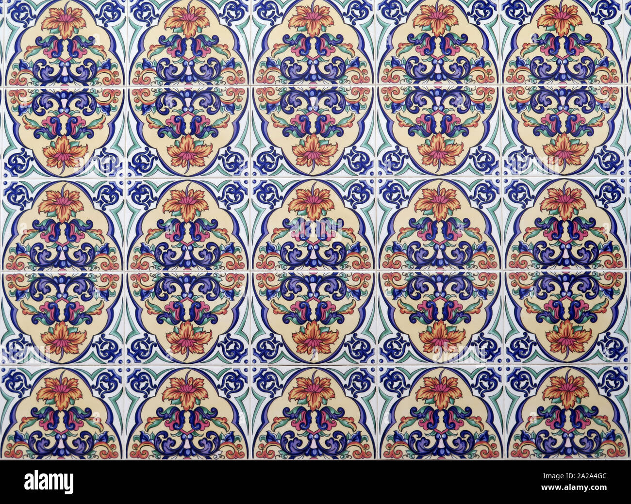 Closeup of Wall tiled with colorful ceramic tiles in village in ...