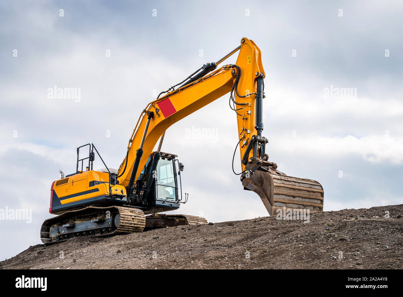 Big excavator in construction site Stock Photo - Alamy