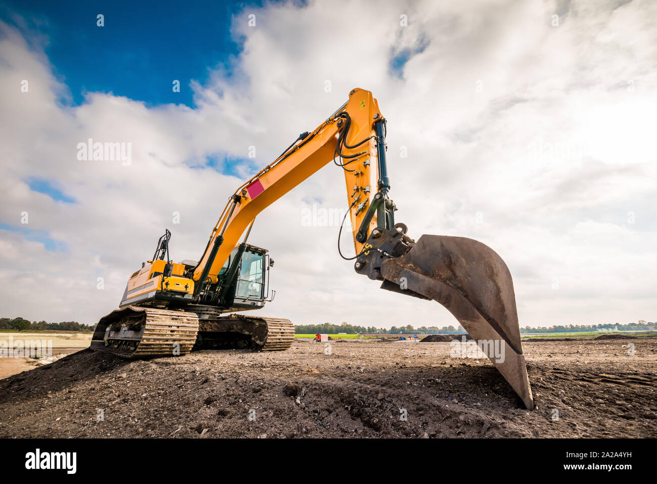 Big excavator in construction site Stock Photo - Alamy