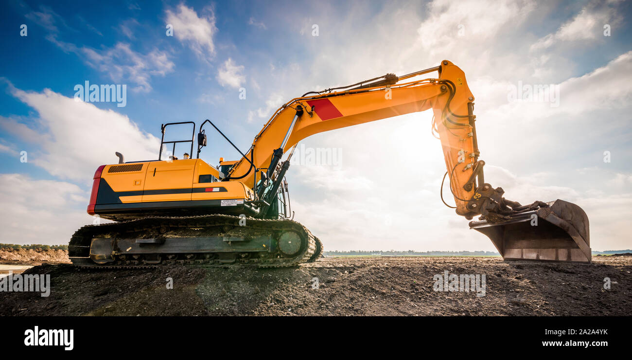 Big excavator in construction site Stock Photo - Alamy