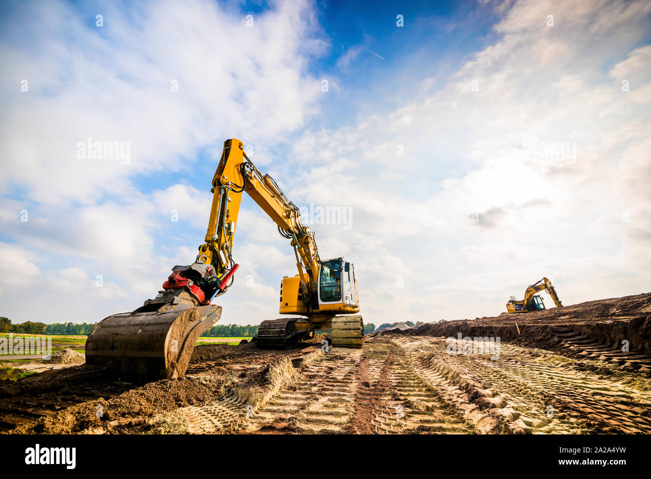 Big excavator in construction site Stock Photo - Alamy