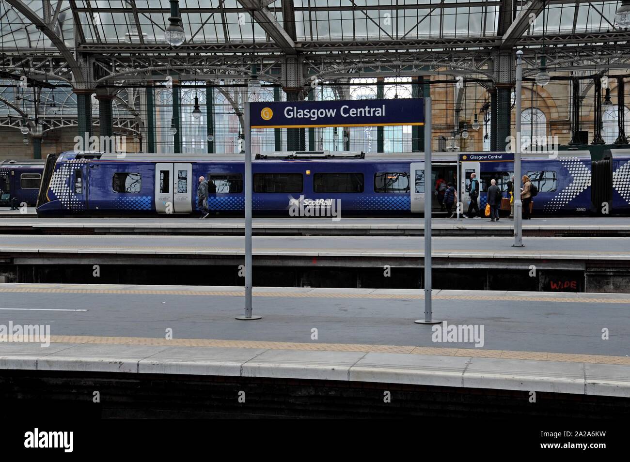 Passengers boarding Scotrail Class 380 Desiro electric trains at ...