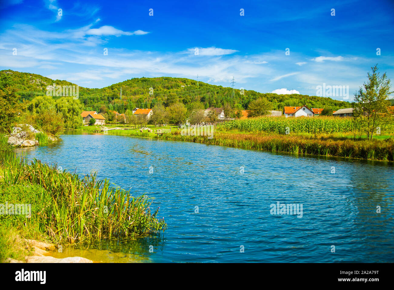 Croatia, countryside rural landscape, village by Gacka river in region ...