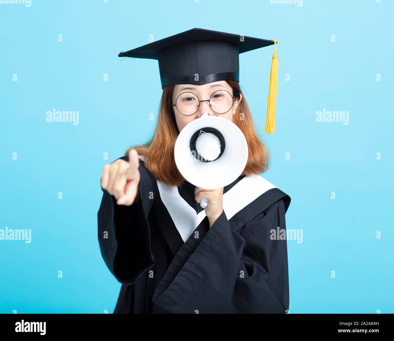 Graduate woman Shouting With Megaphone Stock Photo - Alamy