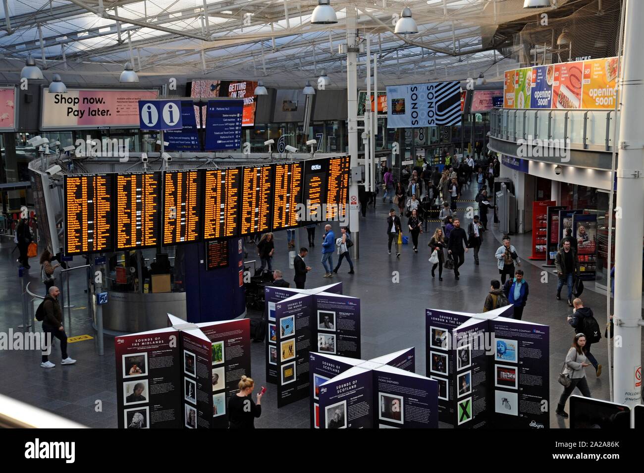 A busy morning at Manchester Piccadilly Station showing the large ...