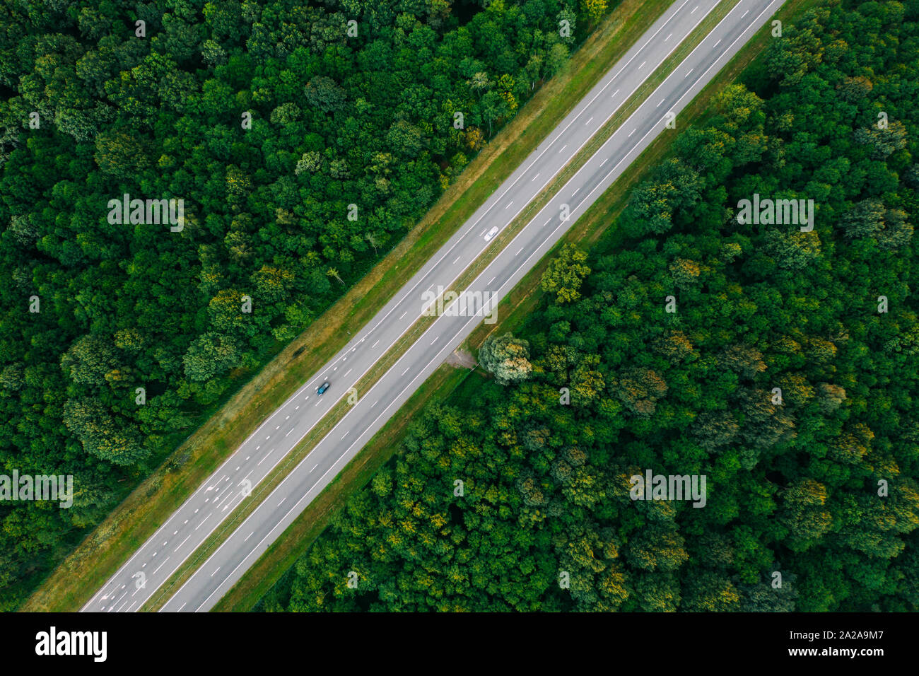 Aerial View Of Highway Road Through Green Forest Landscape In Summer ...