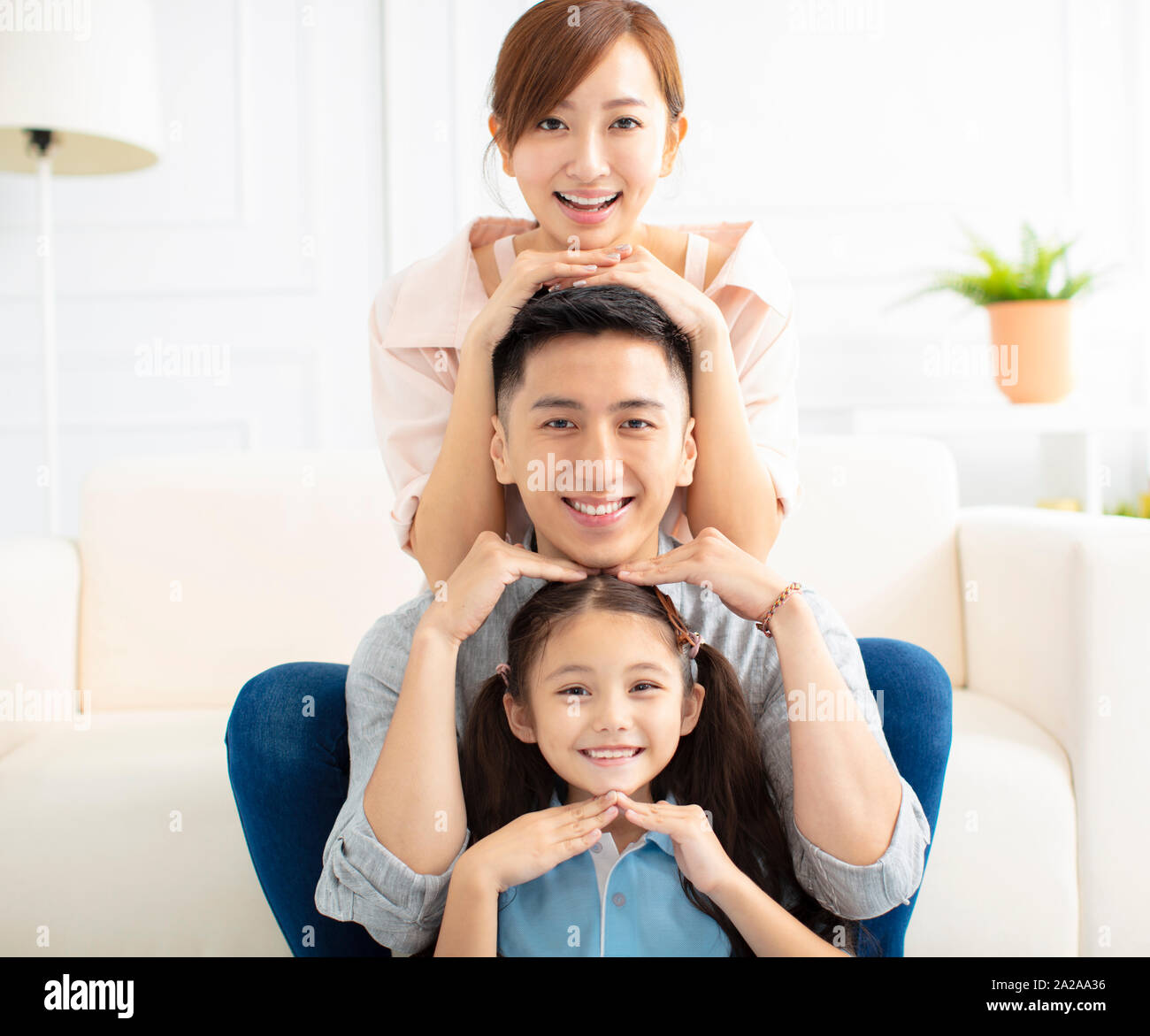 Happy parents and child having fun together Stock Photo - Alamy