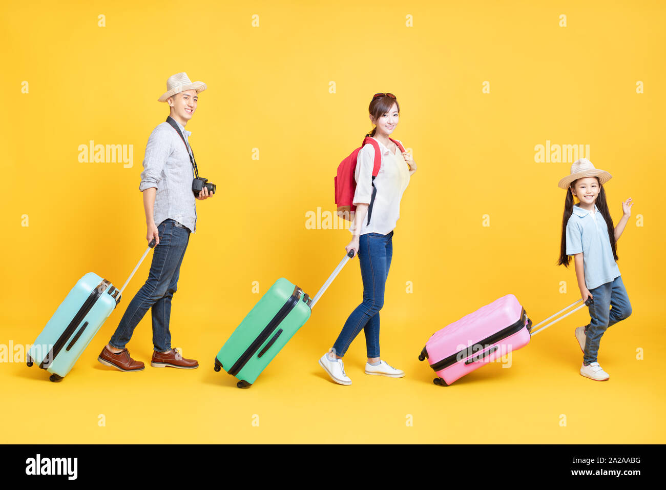 happy family with suitcase going on vacation Stock Photo - Alamy