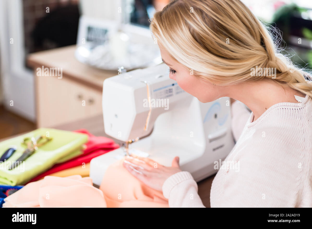 Woman doing tailoring work Stock Photo - Alamy