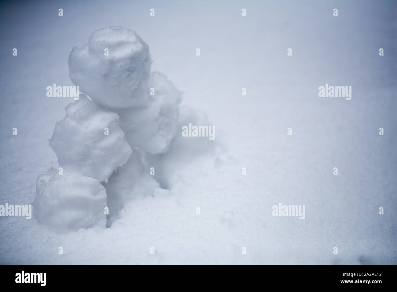 real snowballs with their hands clasped from the fresh snow in winter ...