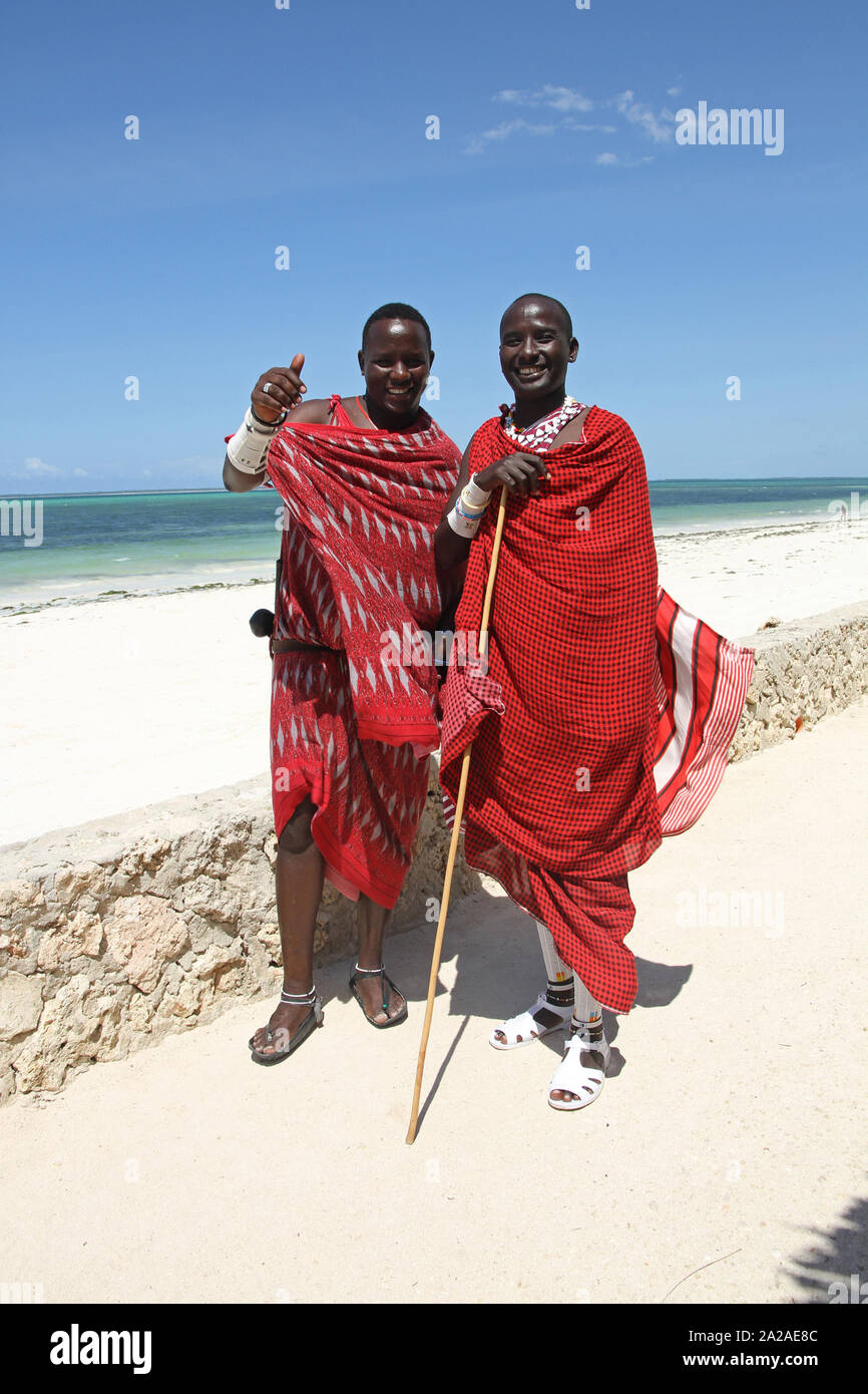 Two Maasai men standing on the beach, Zanzibar, Unguja Island, Tanzania ...