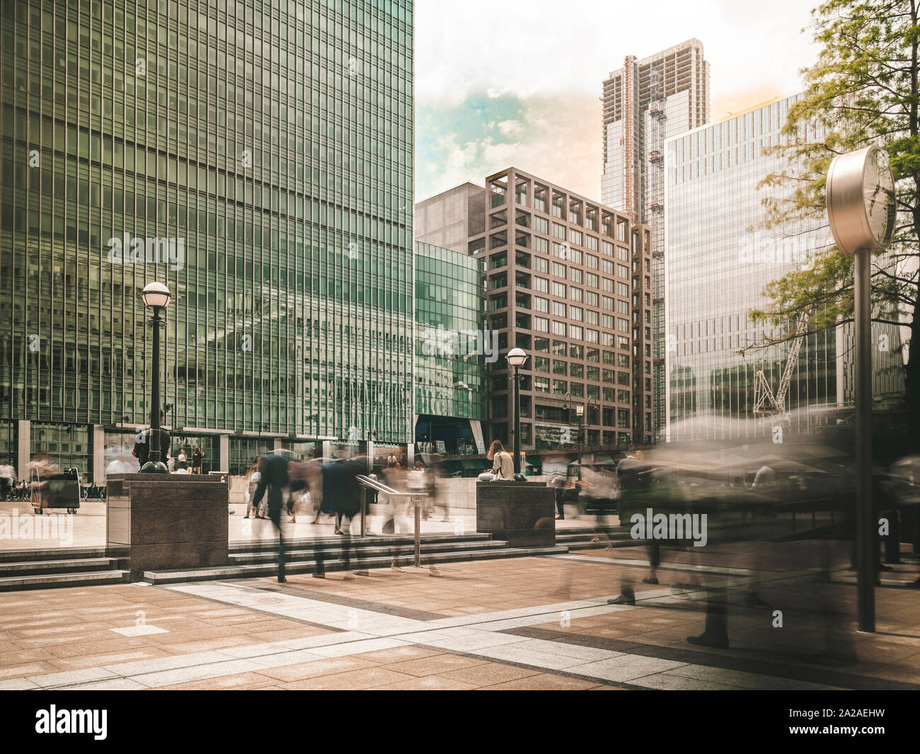 Busy office workers commuting to work outside modern office buildings ...