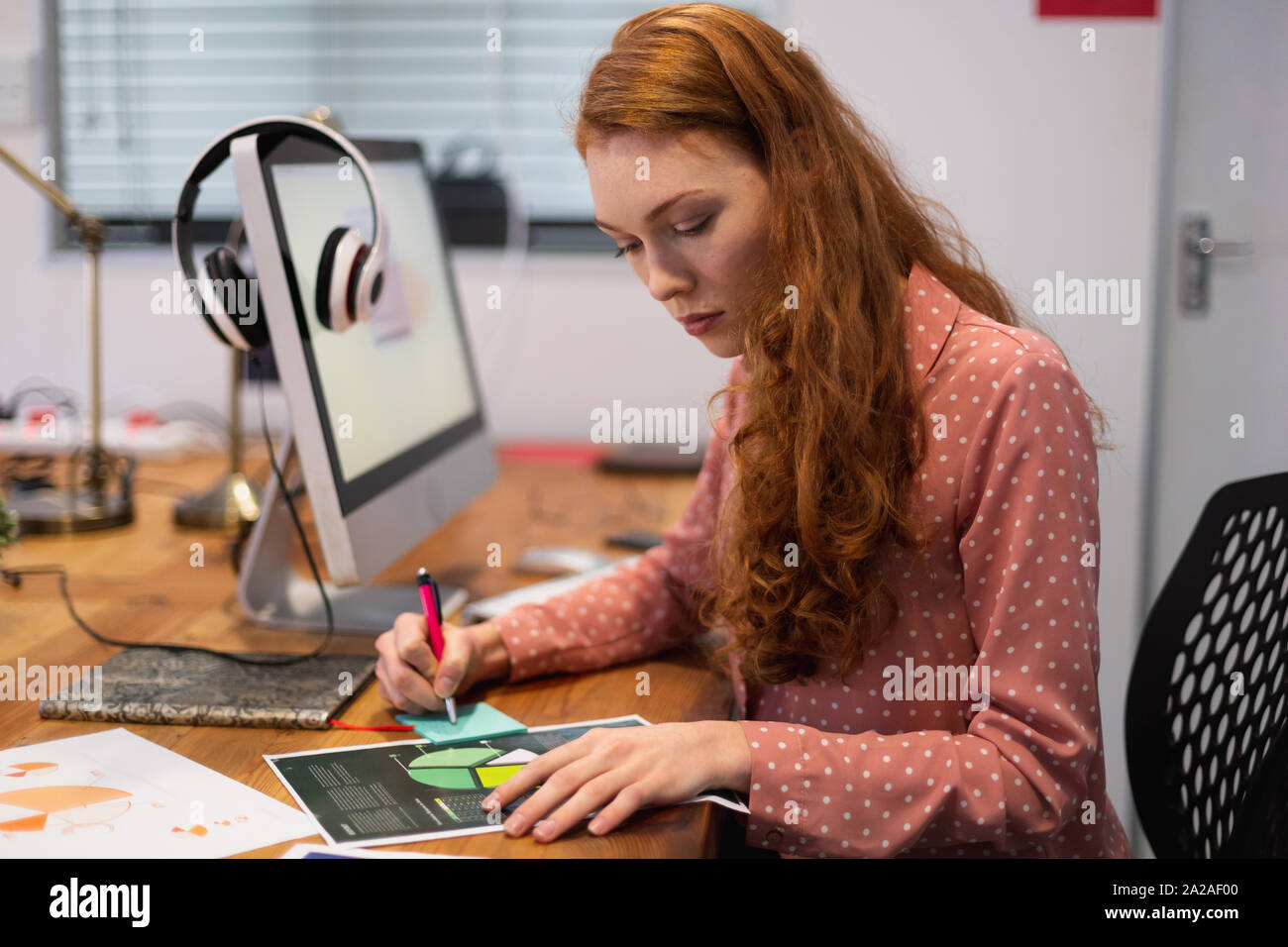 Creatives working in an office Stock Photo - Alamy
