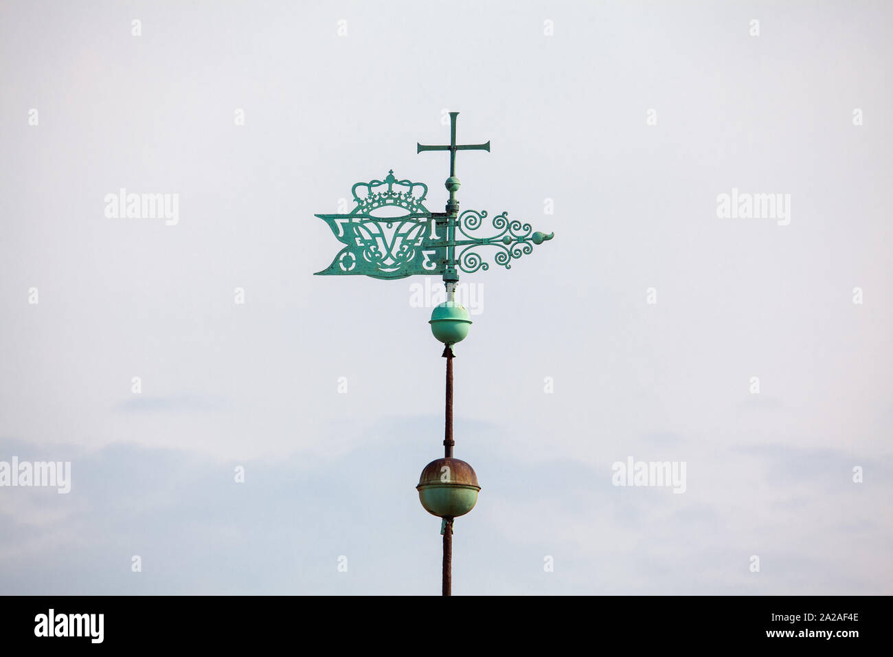 cross with arrow on the church top Stock Photo - Alamy