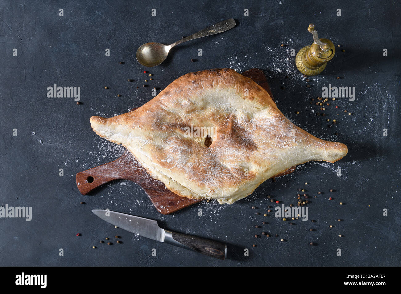 Georgian bread lavash on wooden board on dark rustic background, top ...