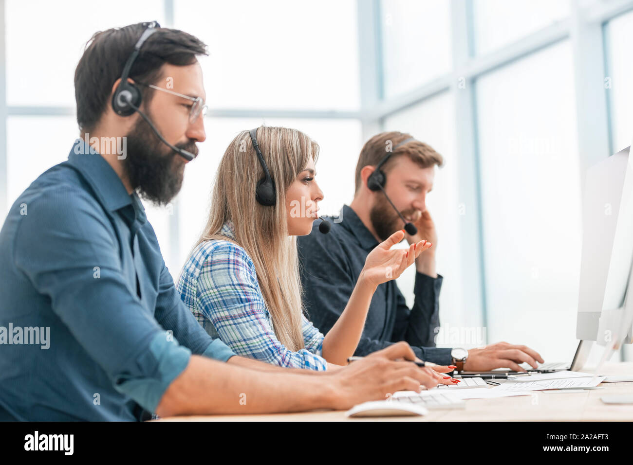 young call center operators in the workplace Stock Photo - Alamy