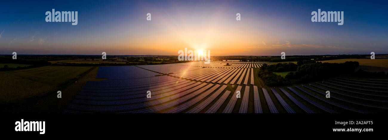 Modern solar farm panoramic at sunrise on a summers day Stock Photo - Alamy