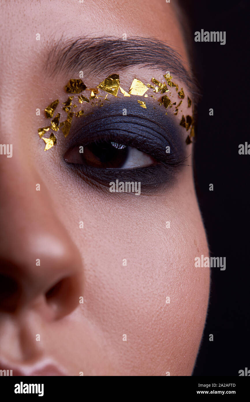 Beauty portrait asian woman with gold spangle eyes Stock Photo - Alamy