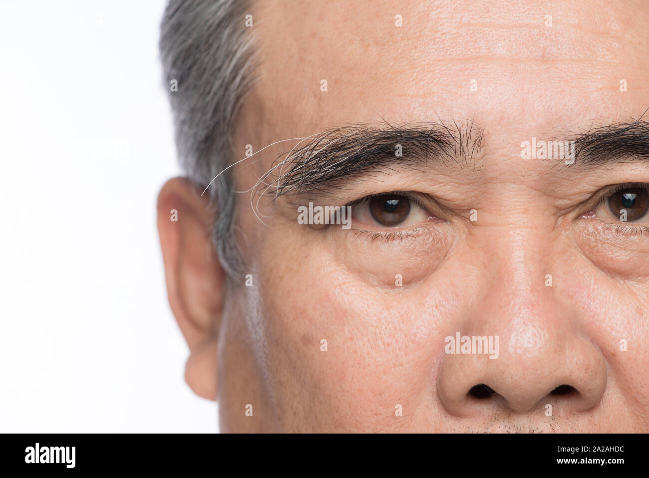 Face of elderly man looking at camera Stock Photo - Alamy