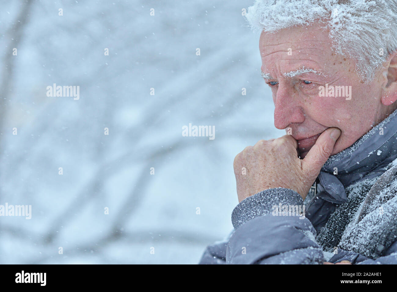 Sad man in snow hi-res stock photography and images - Alamy