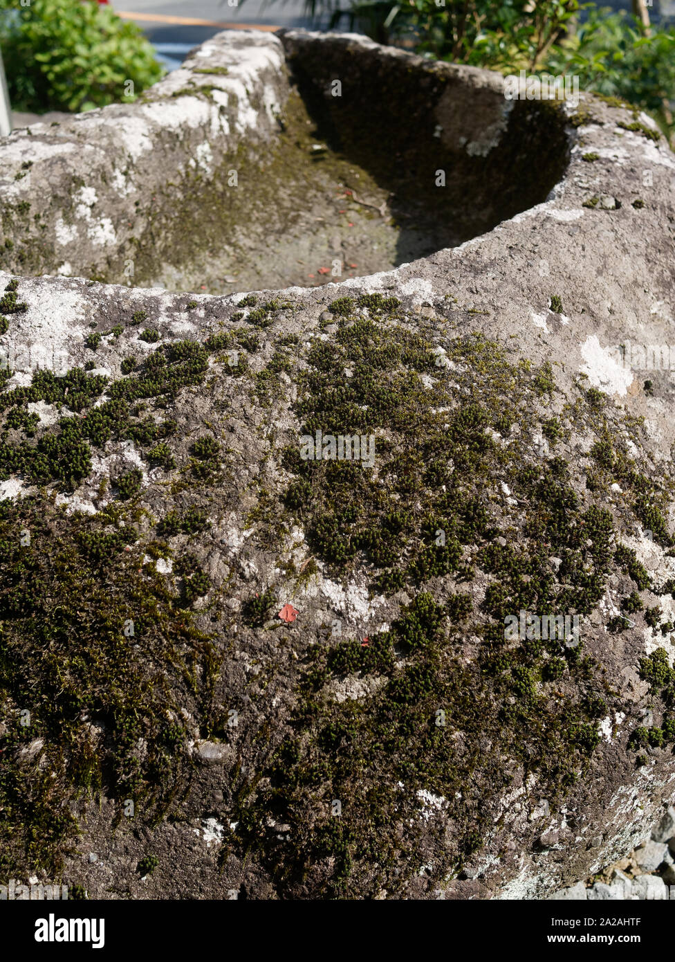 Perspective view of a huge ancient Japanese stone purification basin or ...