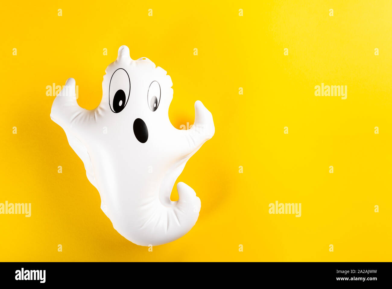 Inflatable white ghost as Halloween party decoration symbol on bright ...
