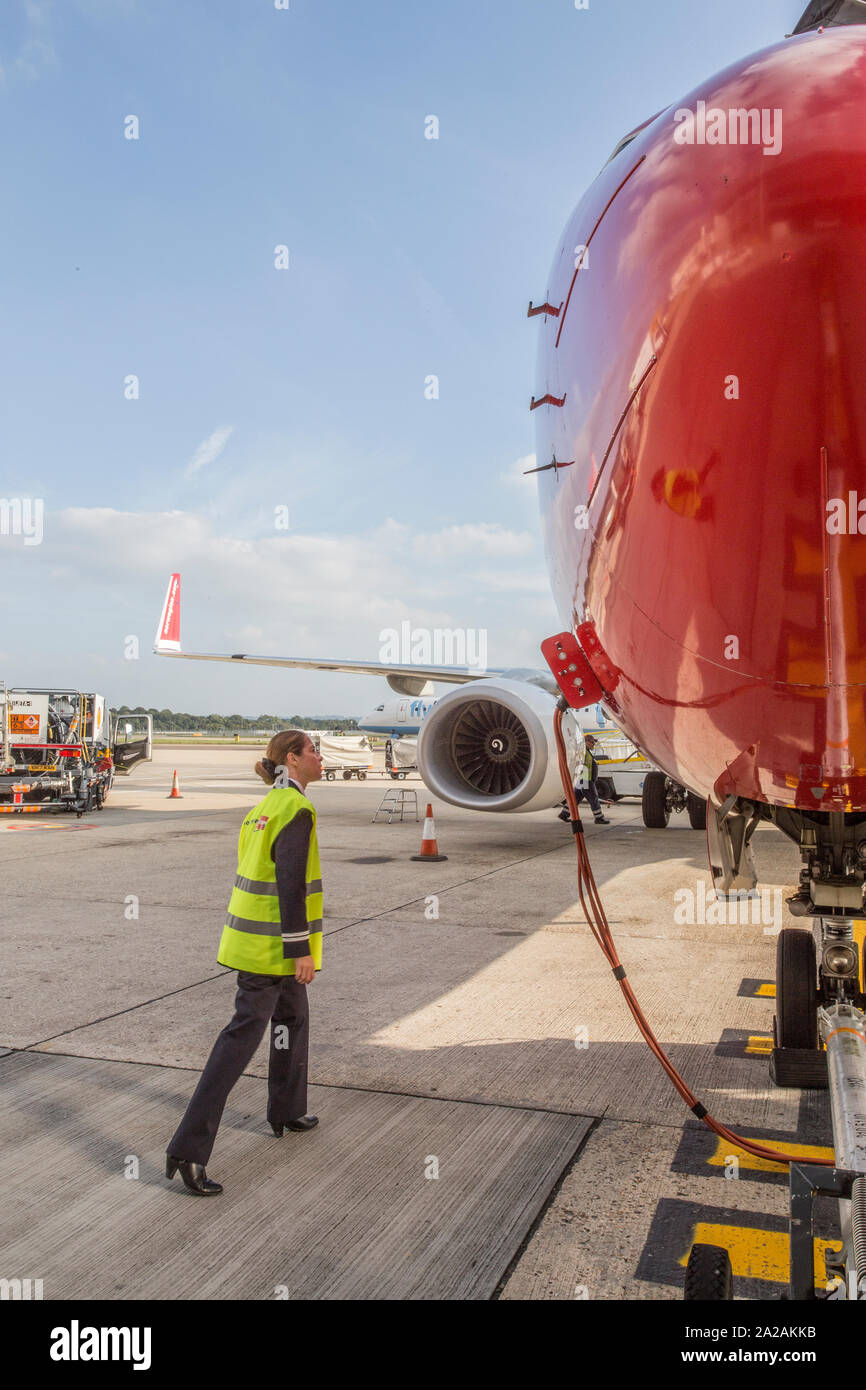 Lady pilot on pre flight checks hi-res stock photography and images - Alamy