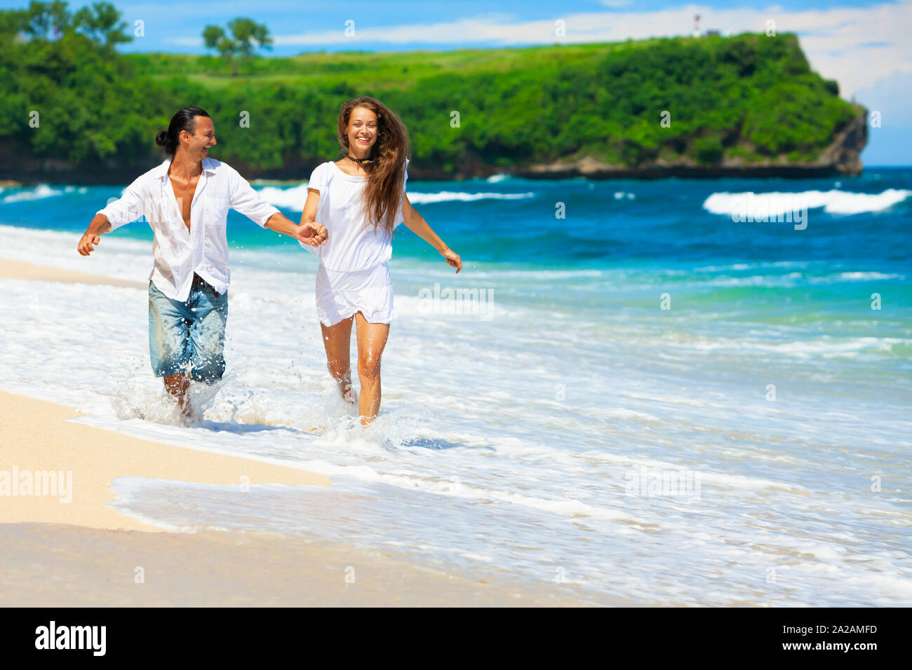 Happy family on honeymoon holiday - just married young couple having ...