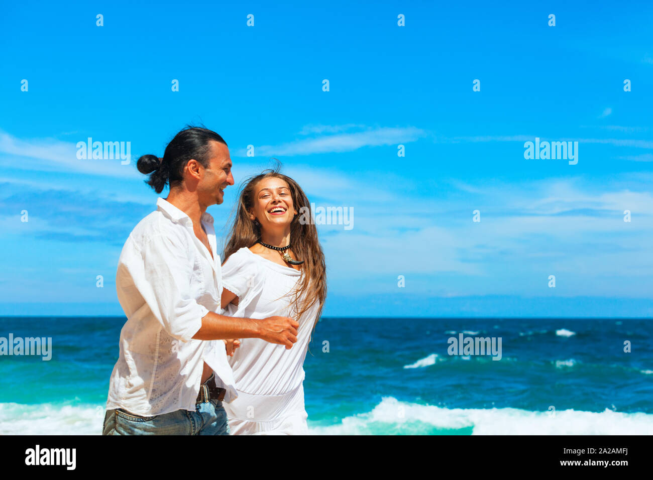 Happy family on honeymoon holiday - just married young couple having ...