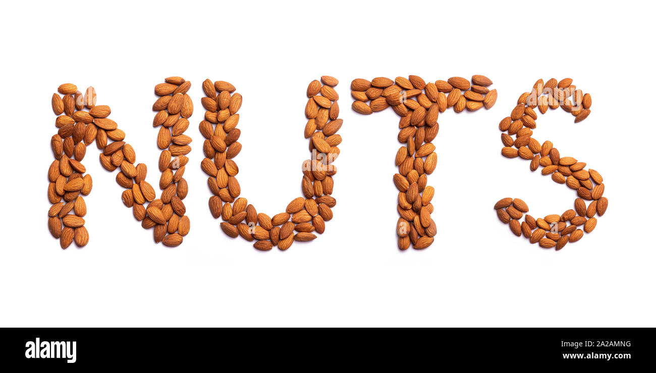 Inscription "Nuts" of the English alphabet from a peeled almond on a ...