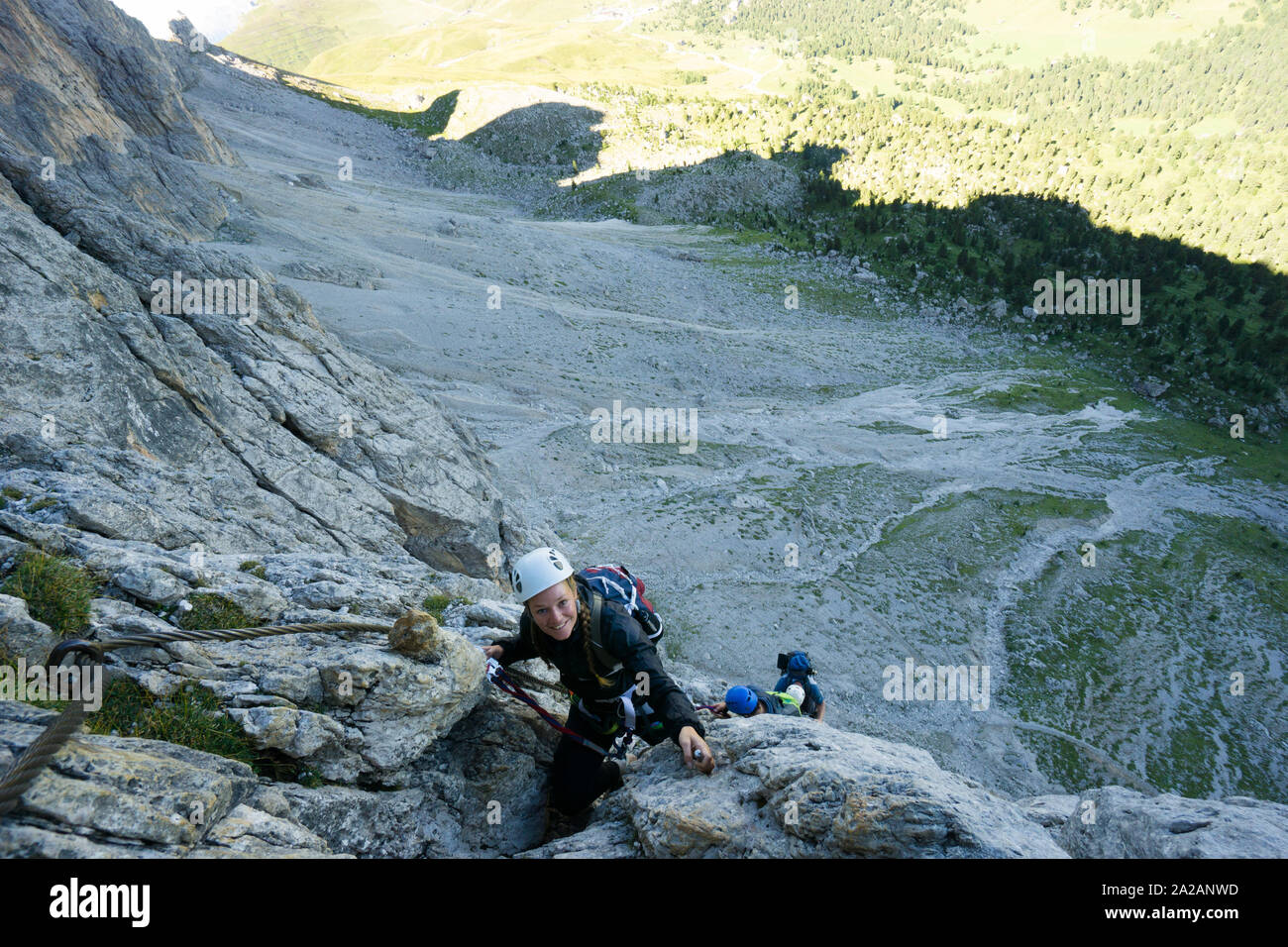 attractive female mountain climber in the Dolomites of Italy on the ...