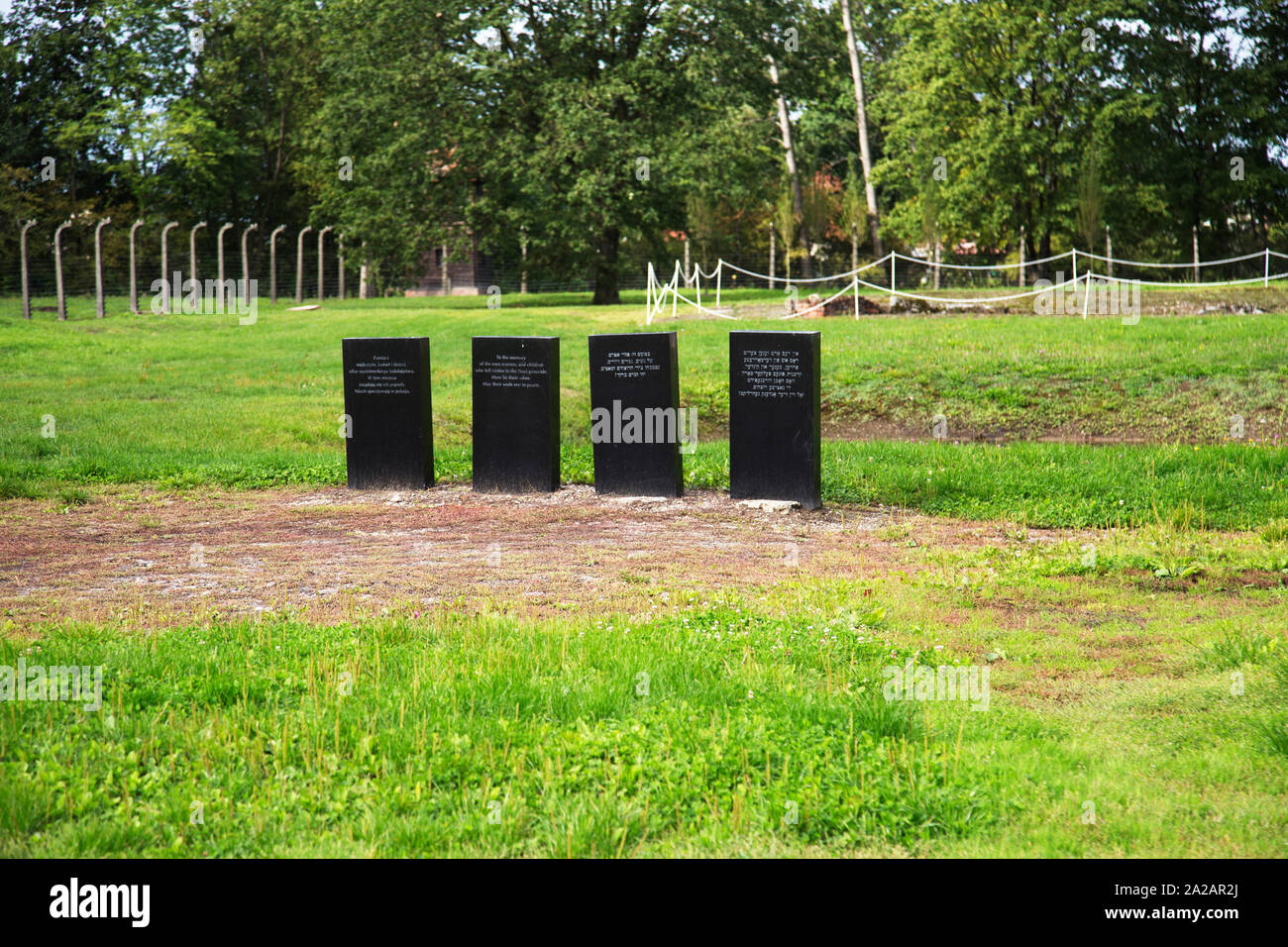 Memorial stones over pits of cremated human remains, Auschwitz-Birkenau ...