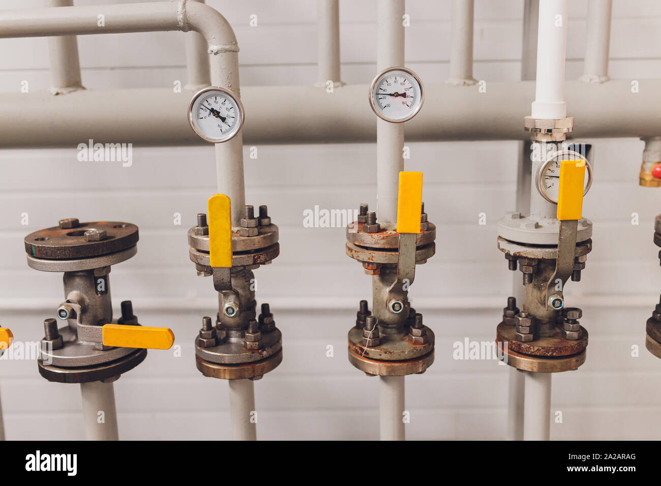 Close up of manometer, pipe, flow meter and faucet valves of heating ...