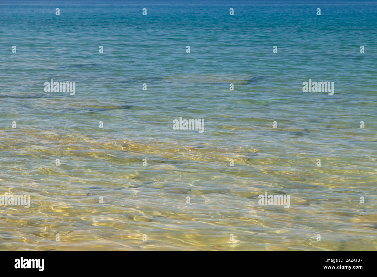 Clear water texture in blue and orange. Background of the ocean and the ...