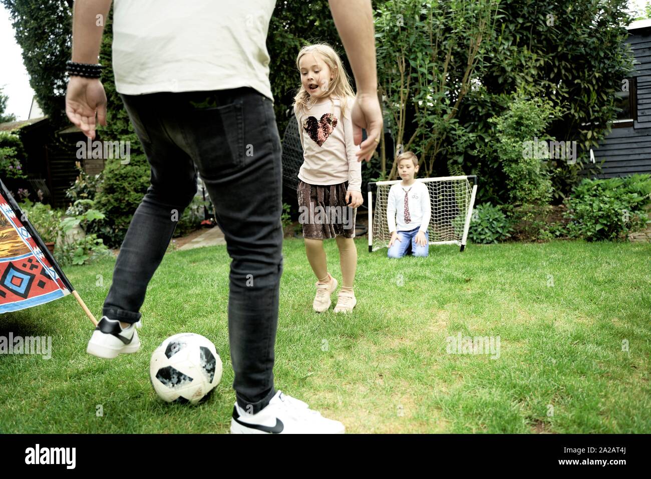 Playing Football In The Garden High Resolution Stock Photography and ...