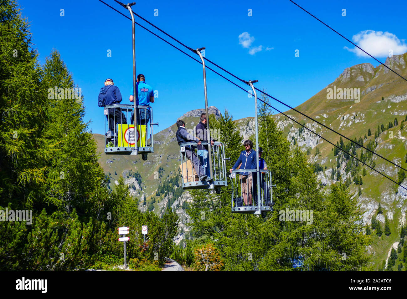 Workmen riding small cable-car, Marmolada mountain, Autumn in the ...