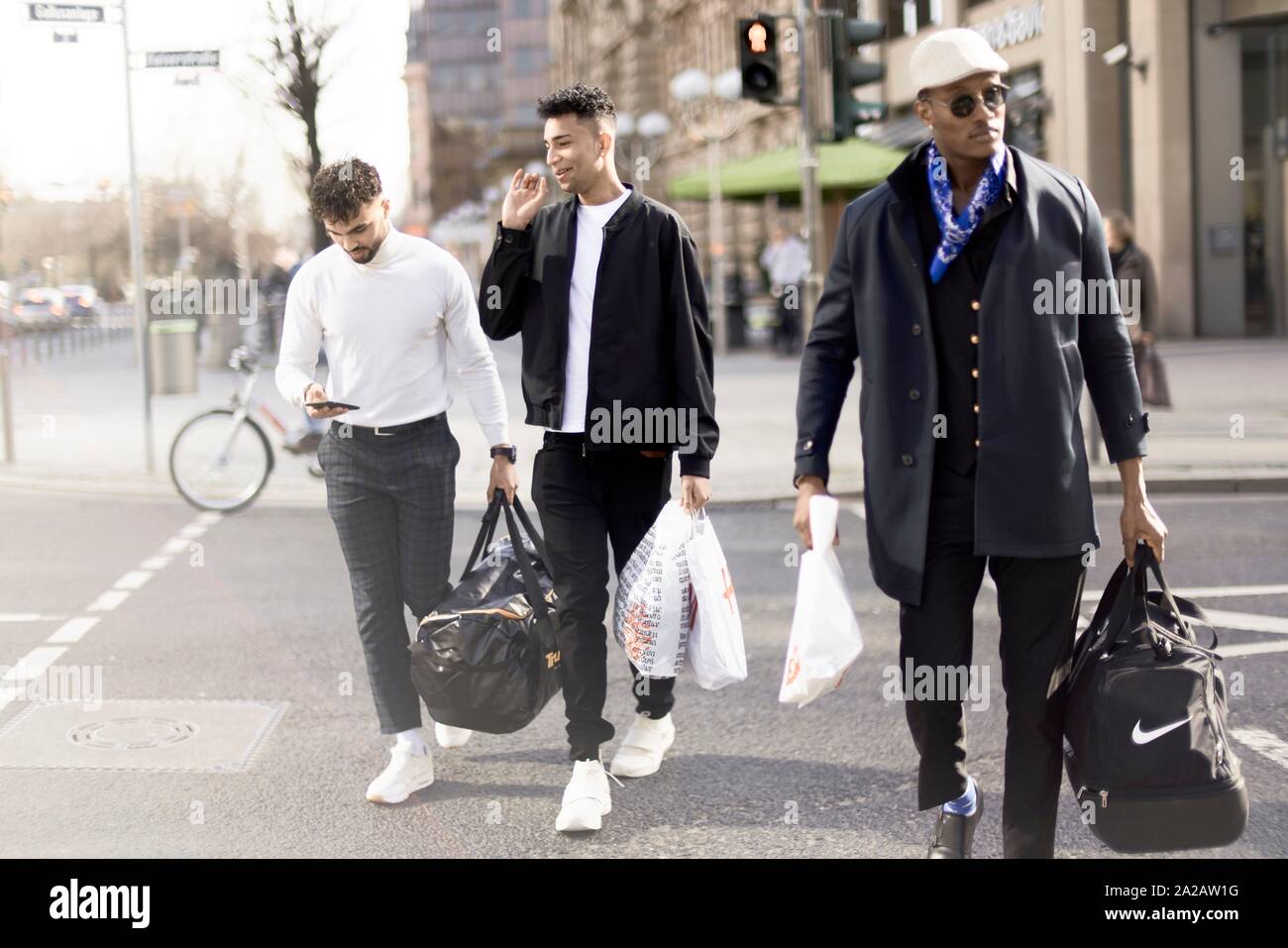 Three Men Crossing The Road High Resolution Stock Photography and ...