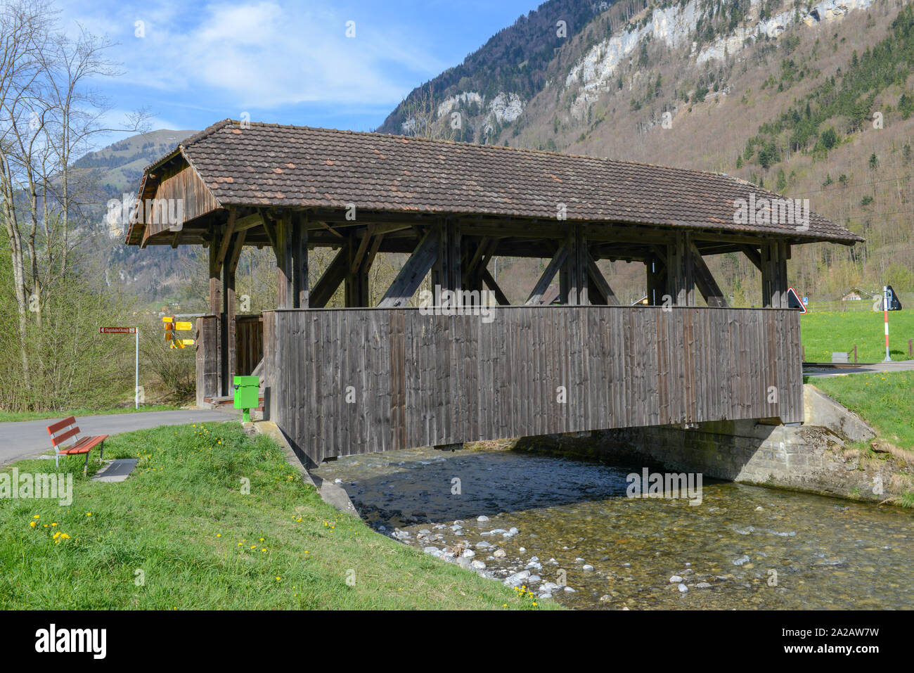 Old covered wooden bridge at Wolfenschiessen on the Swiss alps Stock ...
