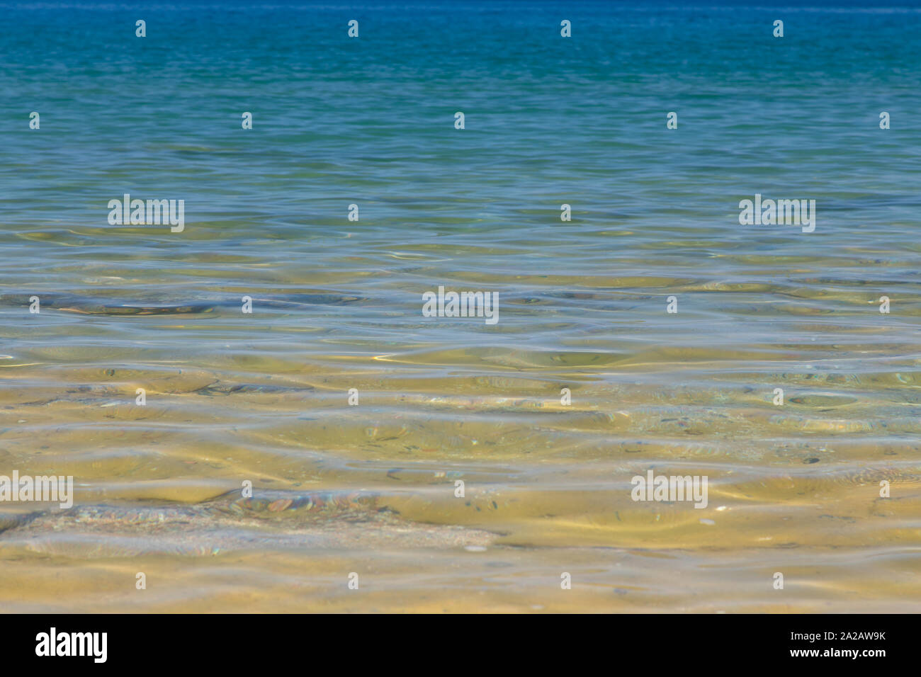 Clear water texture in blue and orange. Background of the ocean and the ...