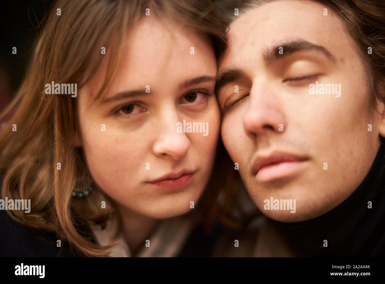 Young Couple Leaning Heads Together High Resolution Stock Photography ...