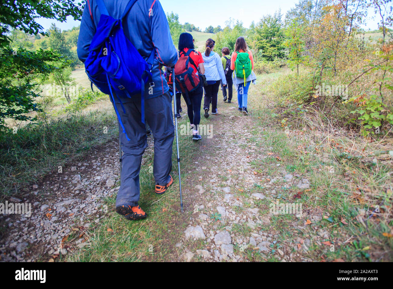 Group of people hiking in nature on autumn day Stock Photo - Alamy