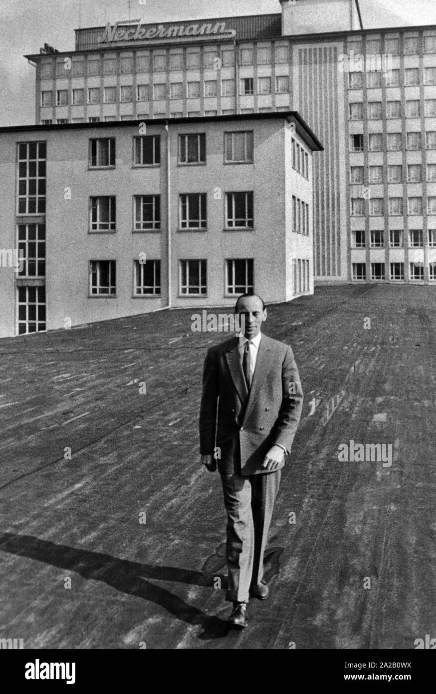 The successful entrepreneur Josef Neckermann walks on the flat roof of ...