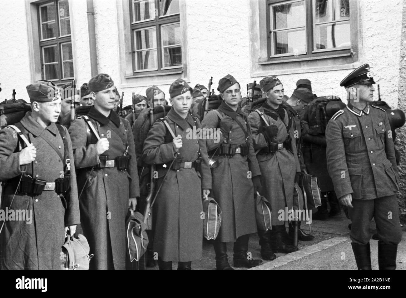 Infantrymen at a stop in a city on the Eastern Front. They carry field ...