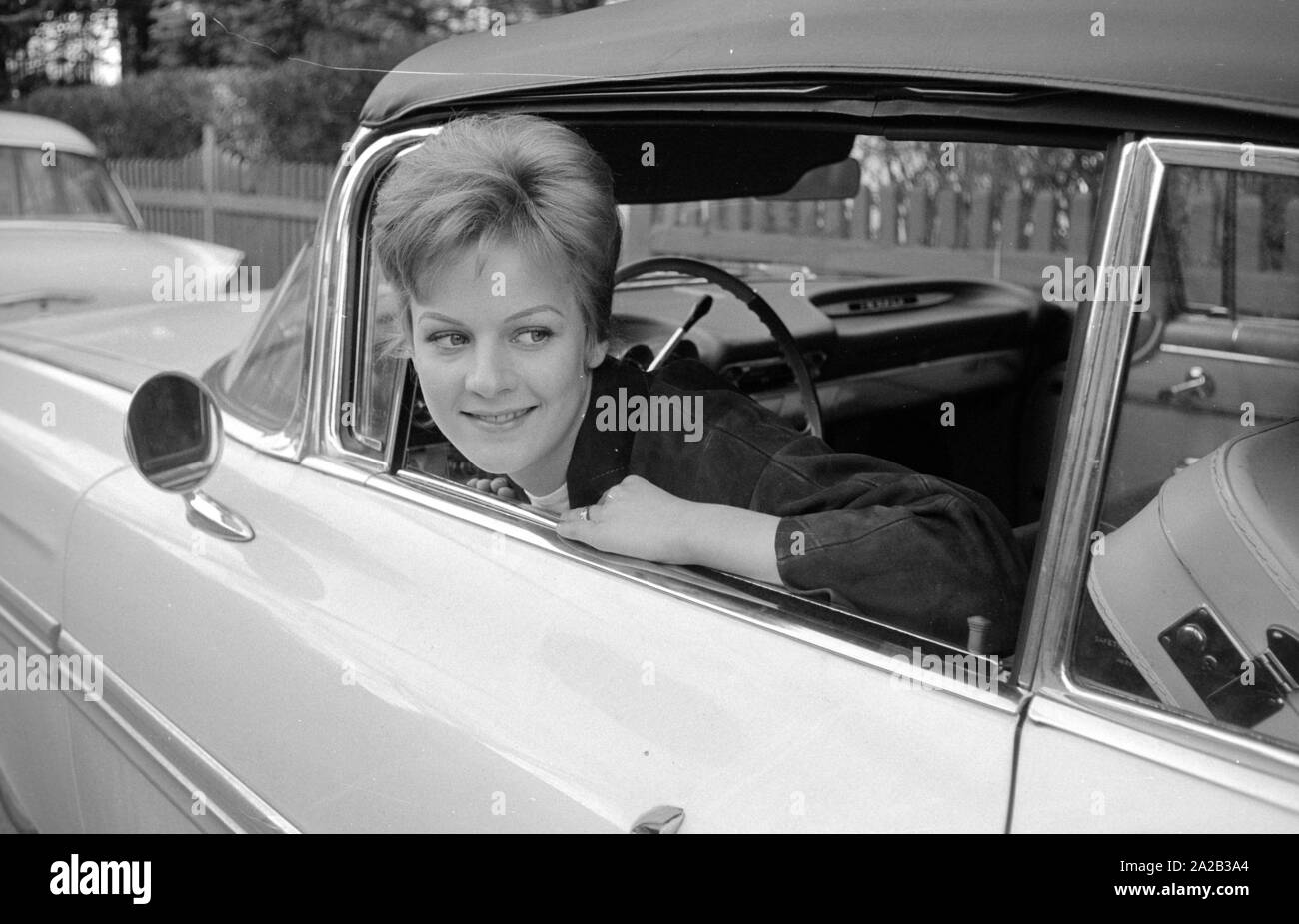 The actress and hit singer Heidi Bruehl sits on the driver's seat of ...