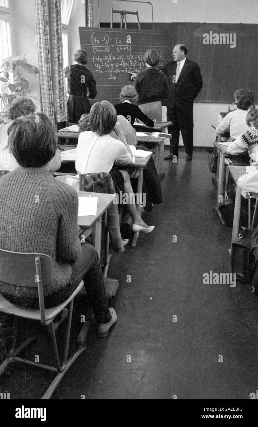 Math class at a school in Germany. A student solves a problem on the ...
