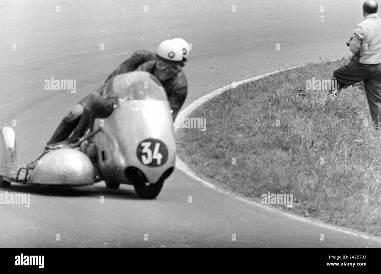 A BMW RS54 with sidecar in a curve on the Solitude. The race track near ...
