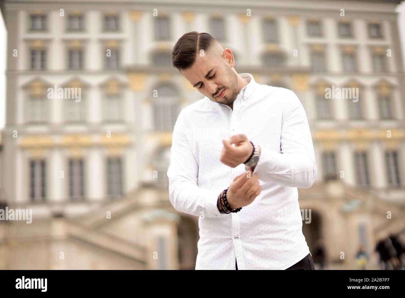 Man adjusting cuffs hi-res stock photography and images - Alamy