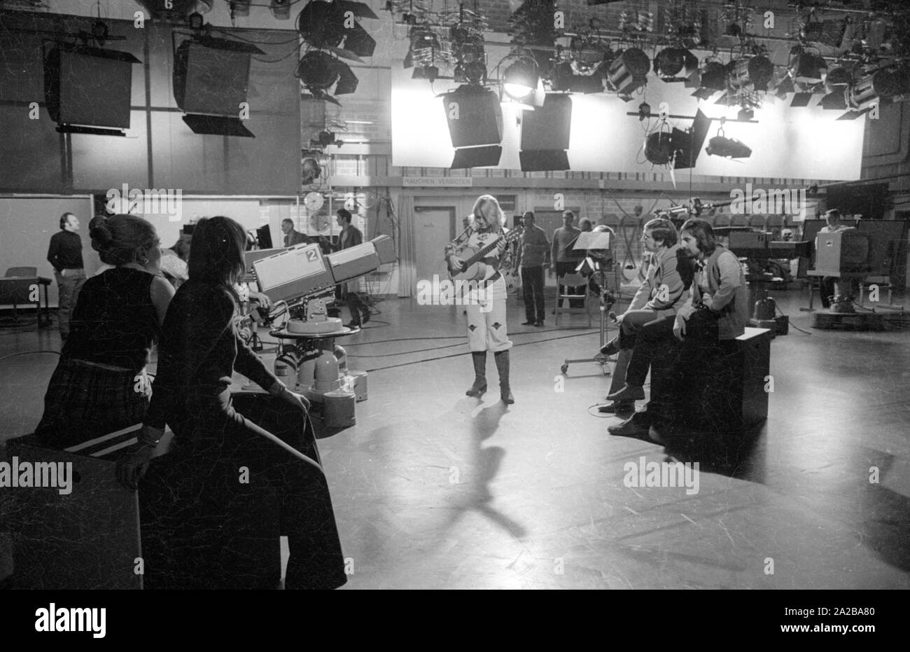 A singer during a television appearance Stock Photo - Alamy