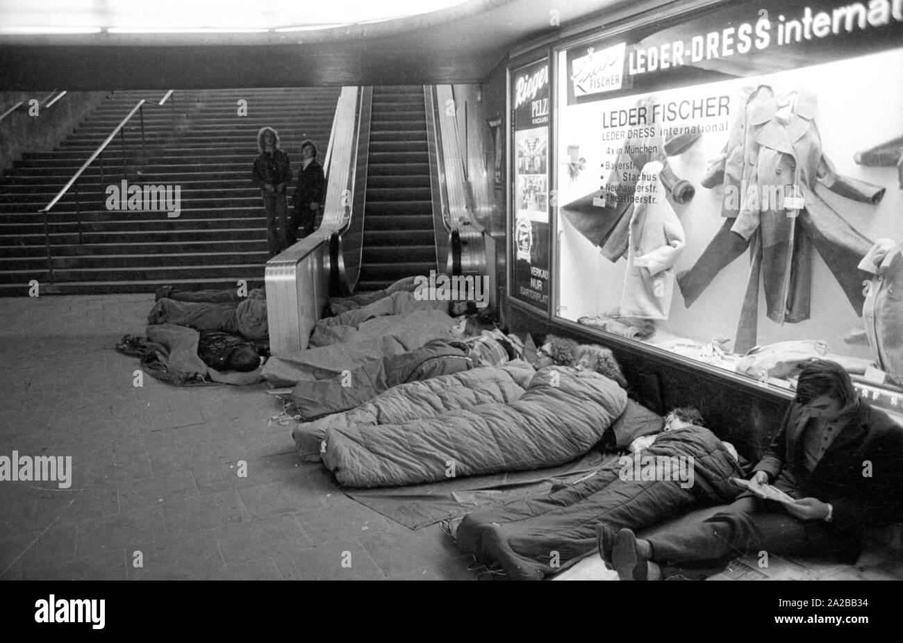 Homeless people sleeping in the mezzanine floor at the Munich Main ...